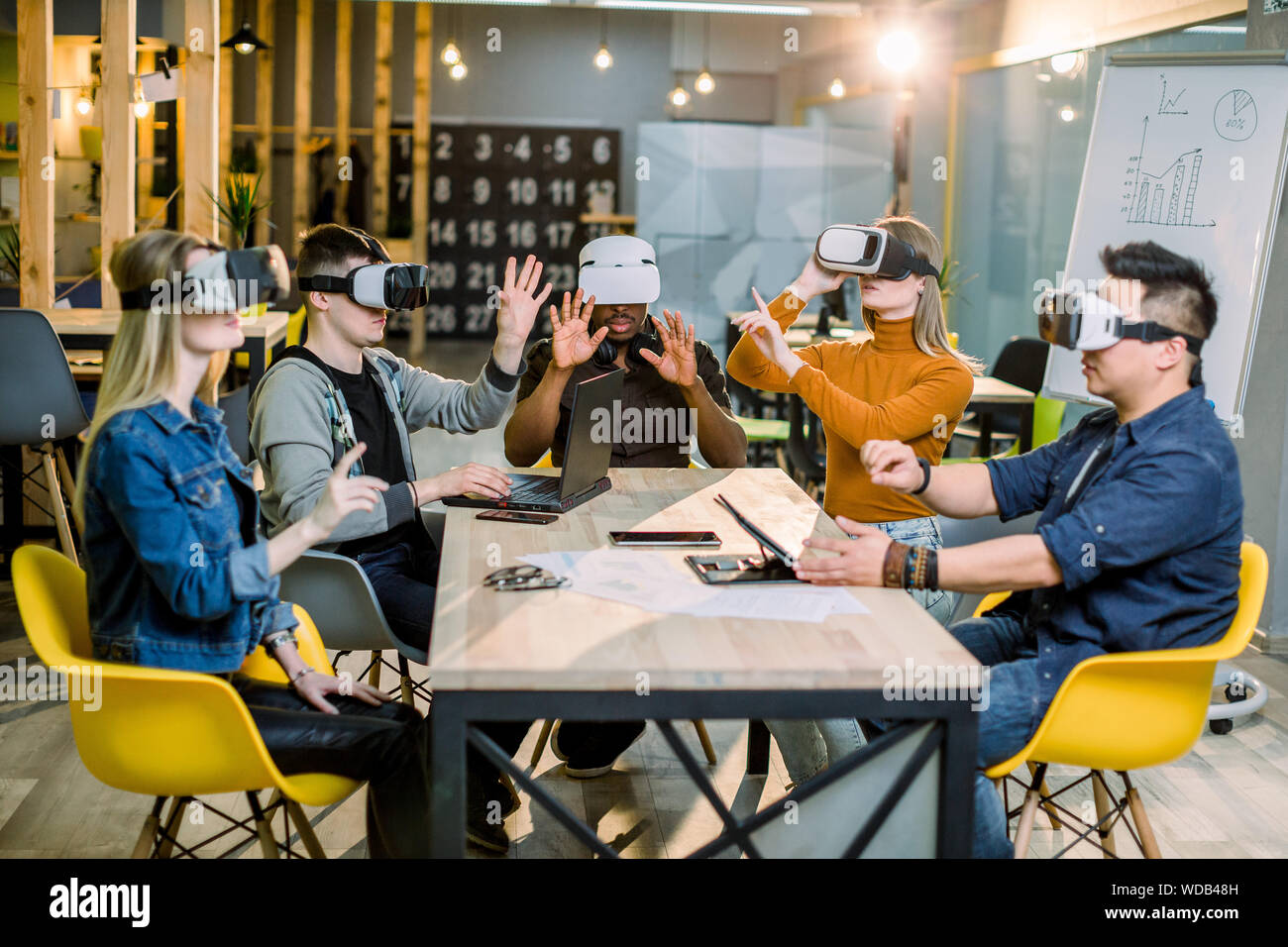 Five diverse business persons are developing a project using virtual ...