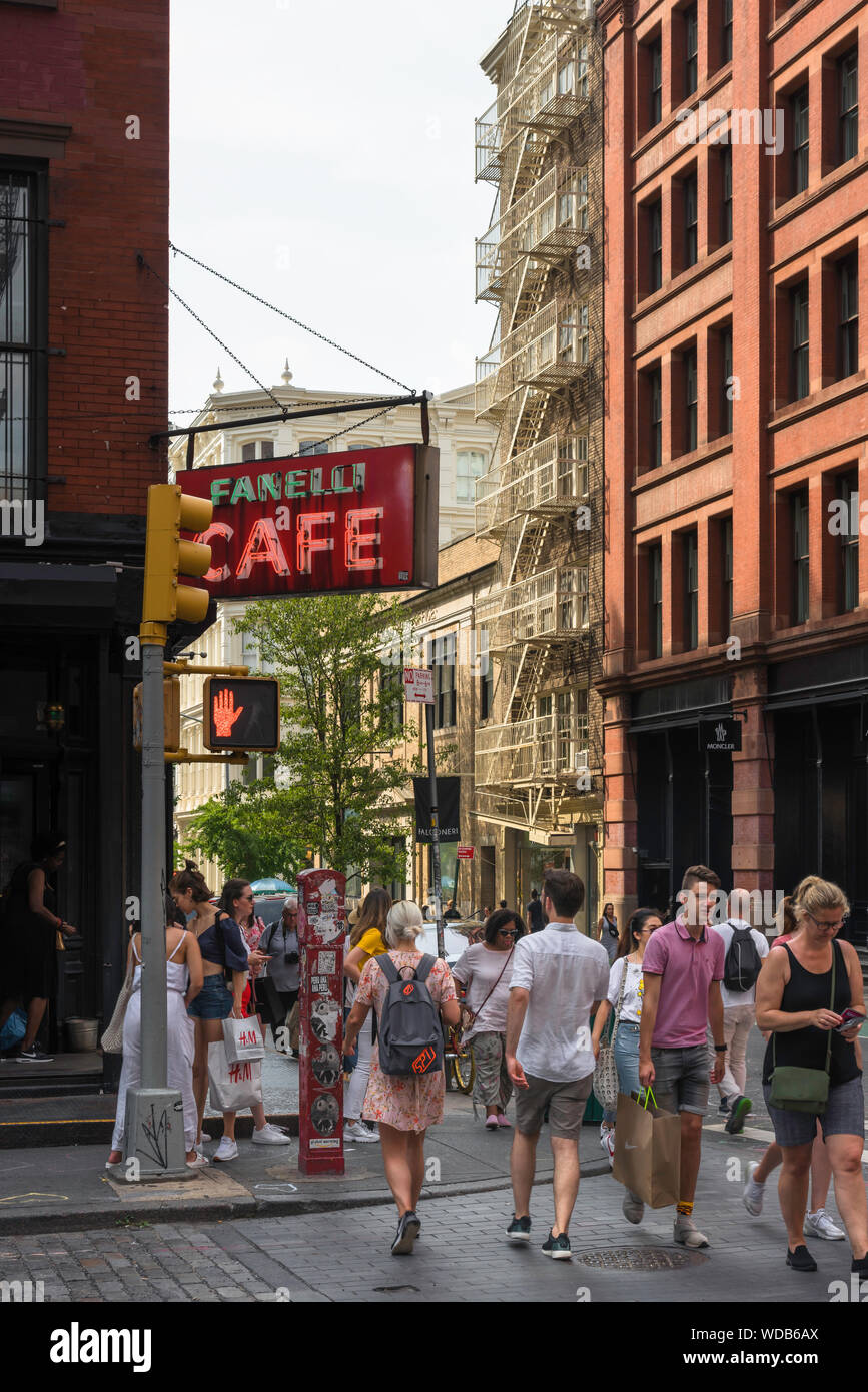 City street New York, view of people in summer walking along a street ...