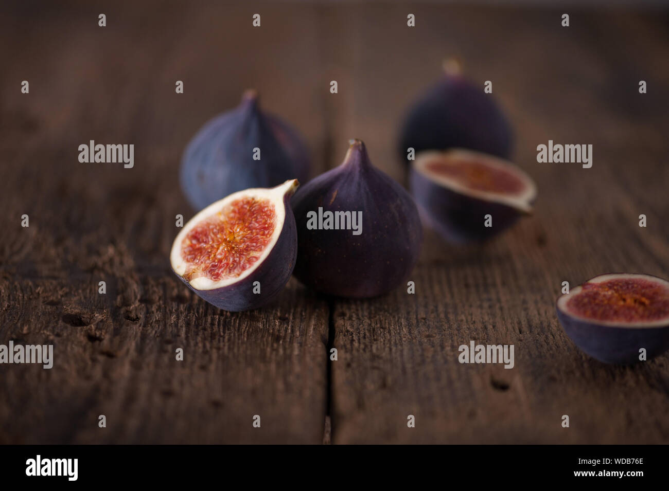 Fresh figues on wooden background Stock Photo - Alamy