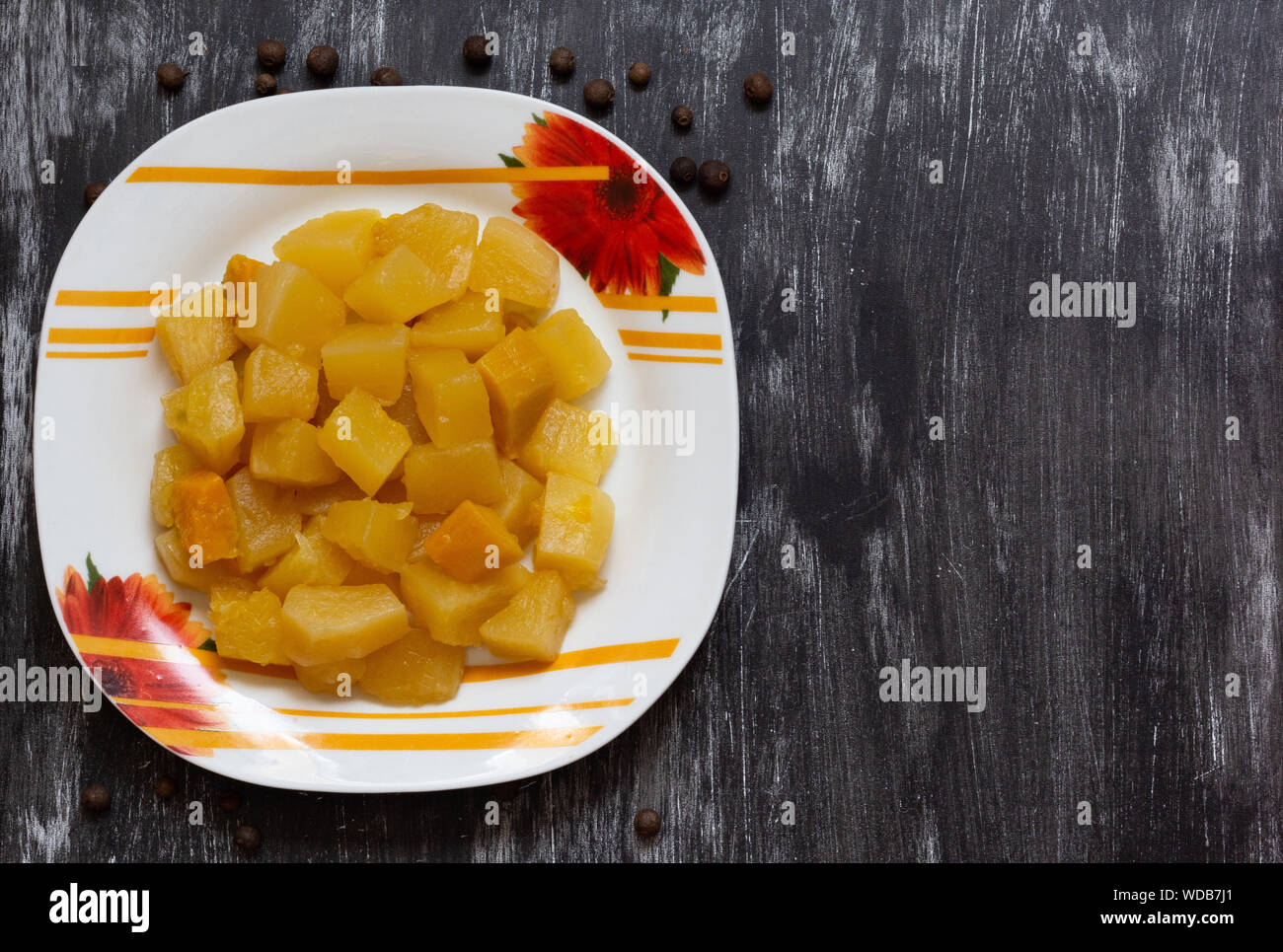 Top view of cut cooked squash on the black background Stock Photo - Alamy