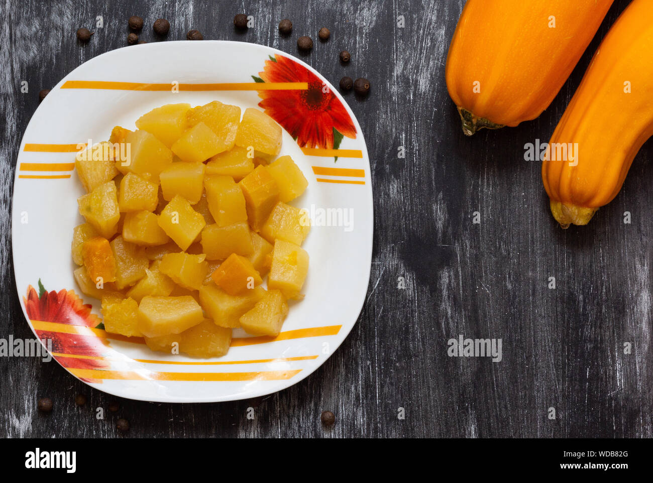 Top view of cut cooked squash on the black background Stock Photo - Alamy