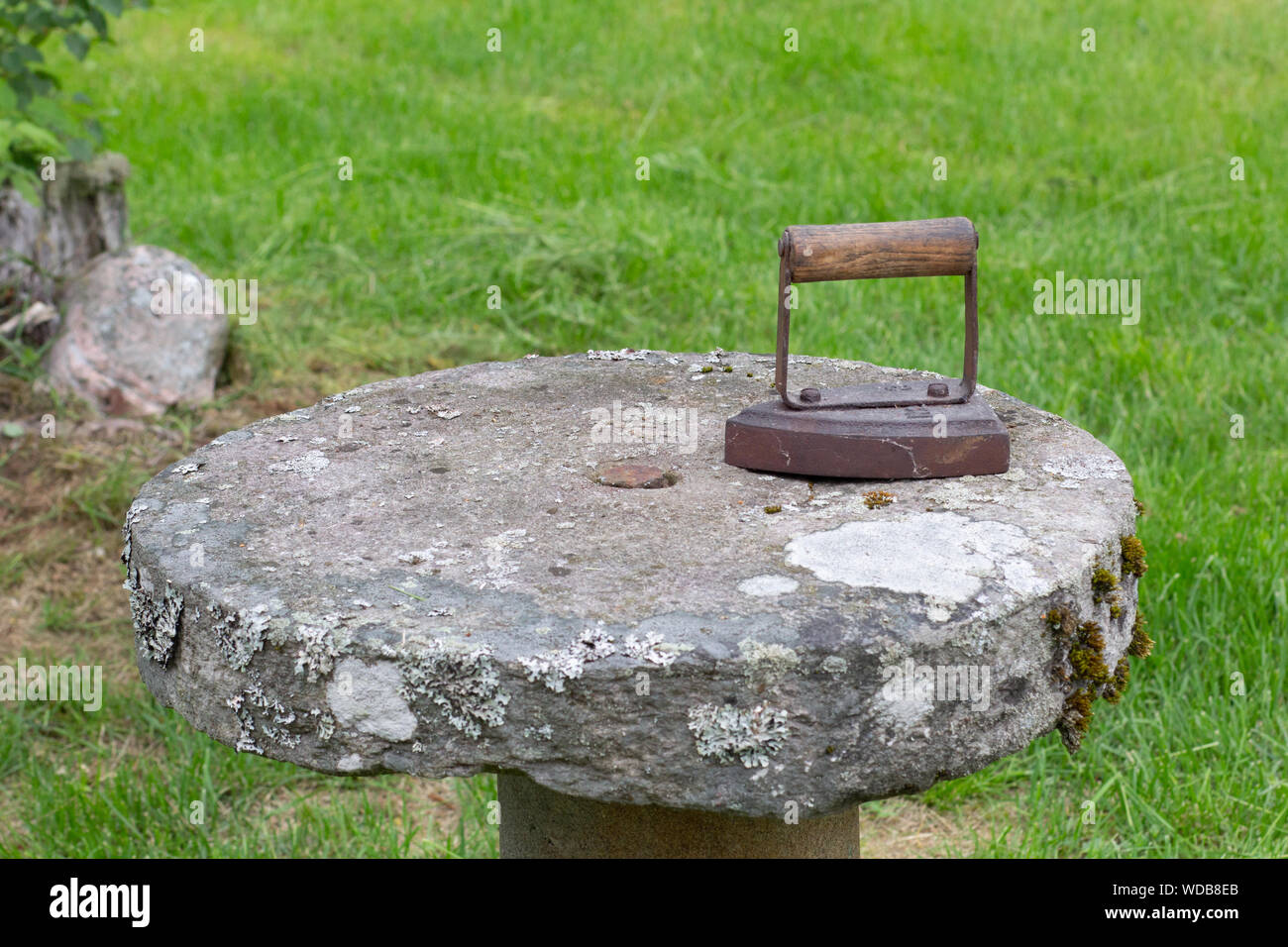 Old iron on stone stand outside Stock Photo - Alamy
