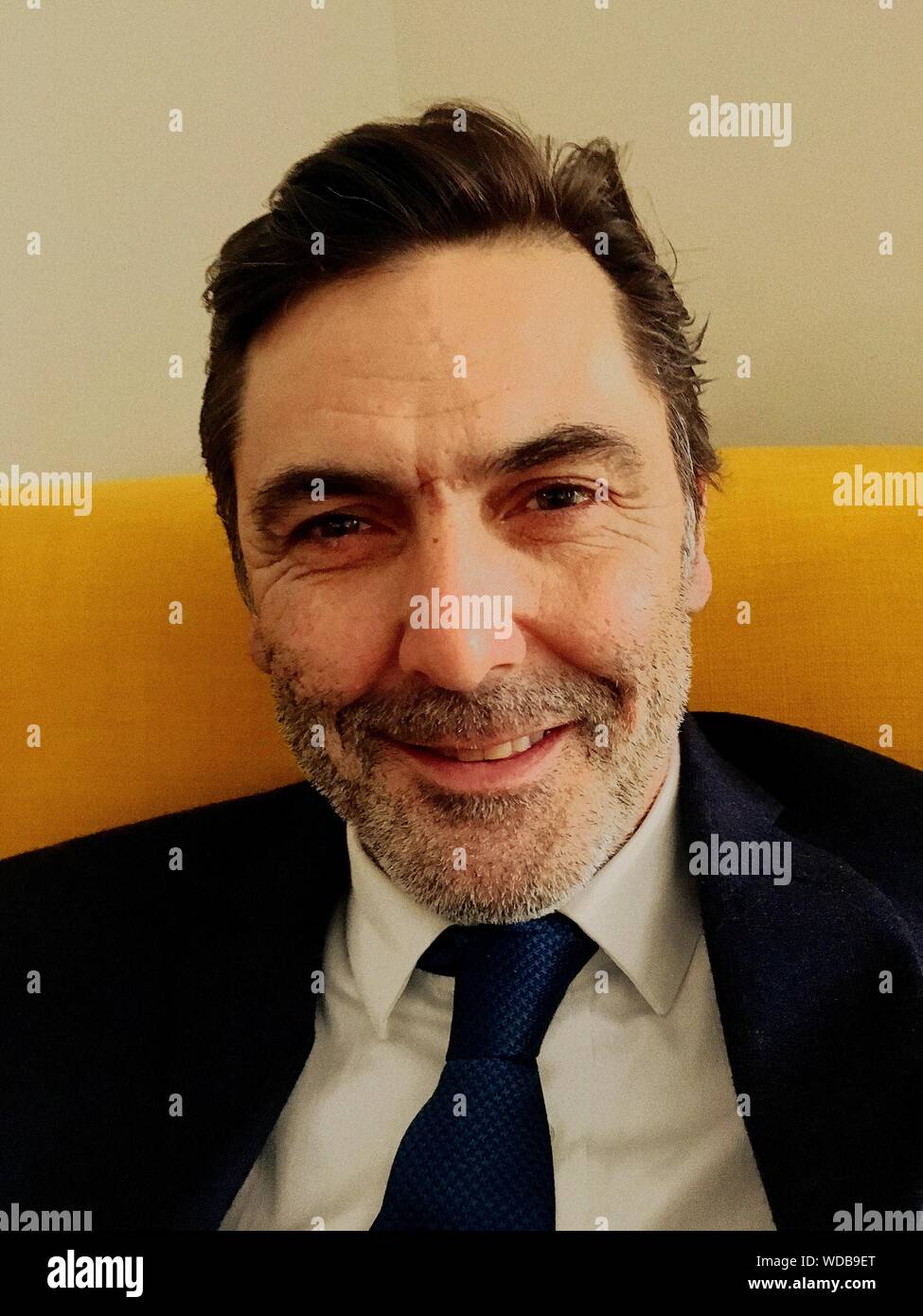 Smiling man in suit hi-res stock photography and images - Alamy