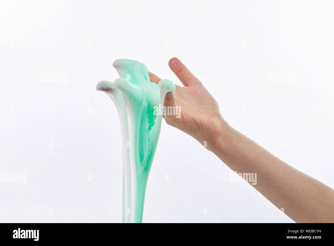 Child hand playing with slime. Isolated on white background Stock Photo ...