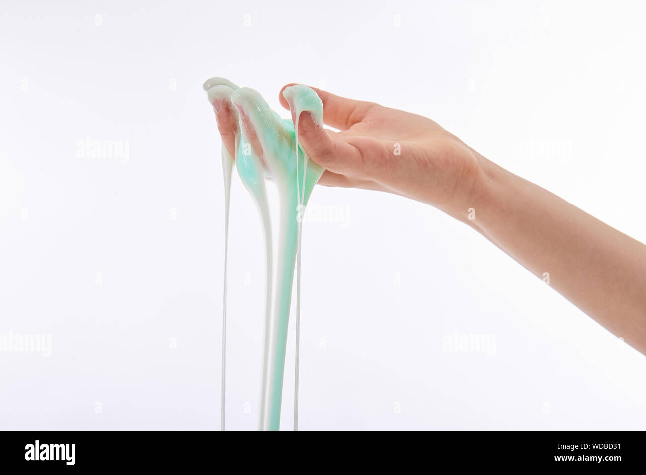 Child hand playing with slime. Isolated on white background Stock Photo ...