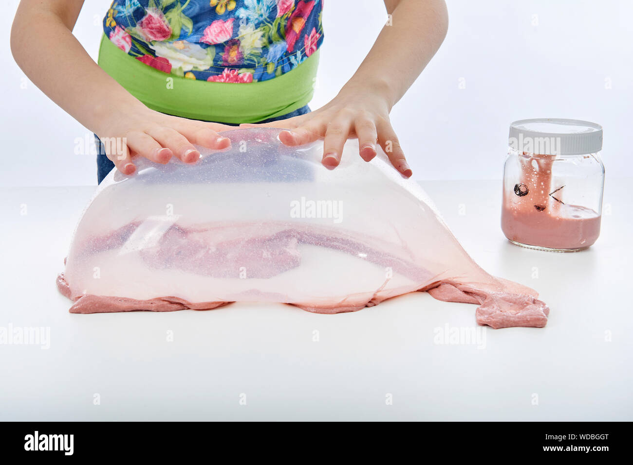 Young girl making big slime bubble. Isolated on white background Stock ...