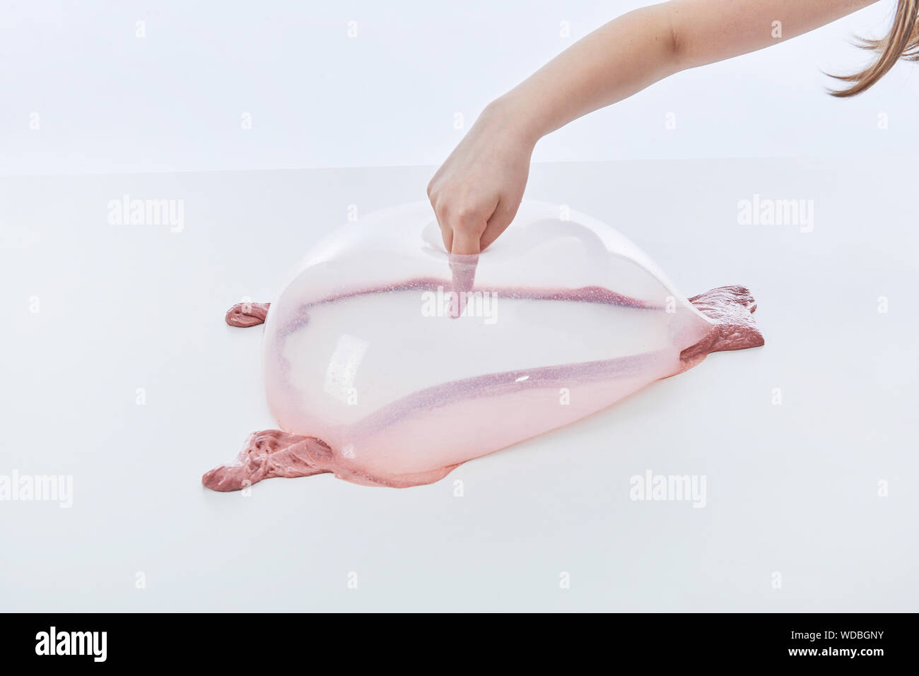 Young girl making big slime bubble. Isolated on white background Stock ...