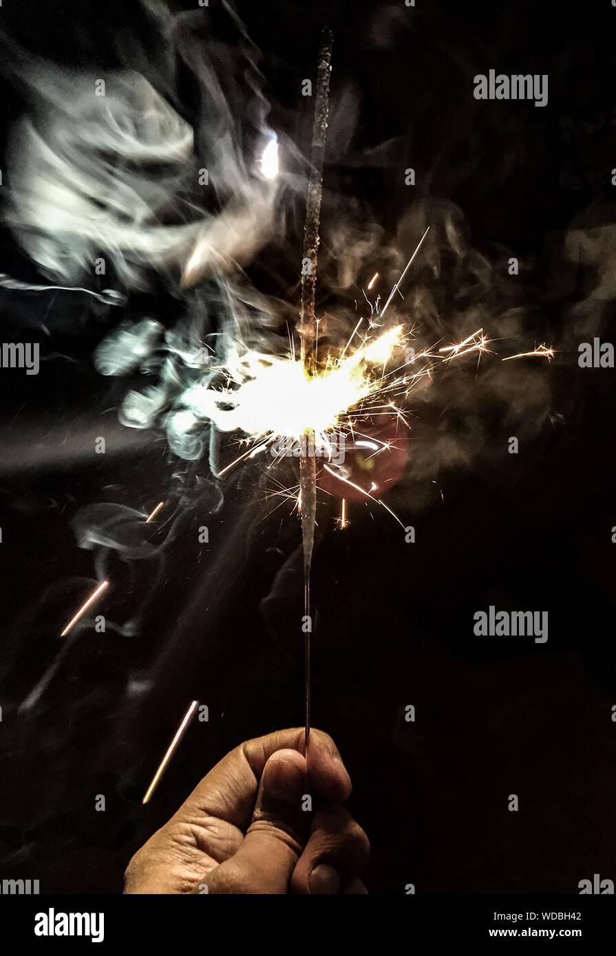 Hand lighting firework hi-res stock photography and images - Alamy