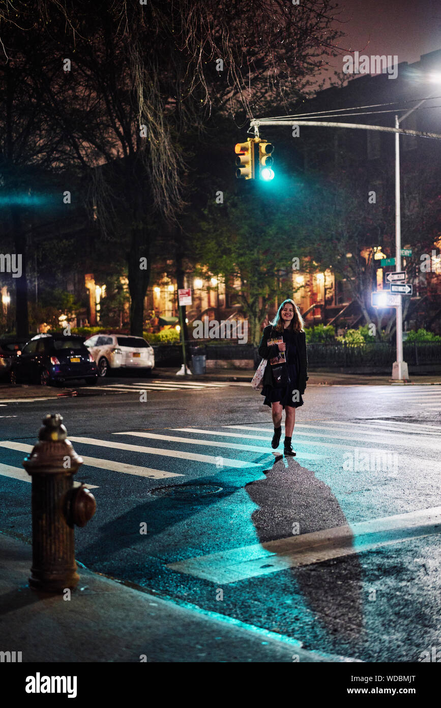 Woman crossing traffic light hi-res stock photography and images - Alamy