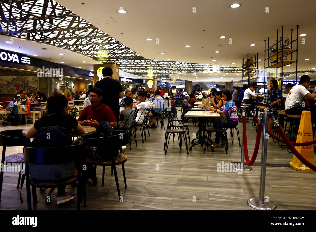 QUEZON CITY, PHILIPPINES – AUGUST 25, 2019: Customers eat their meal at ...