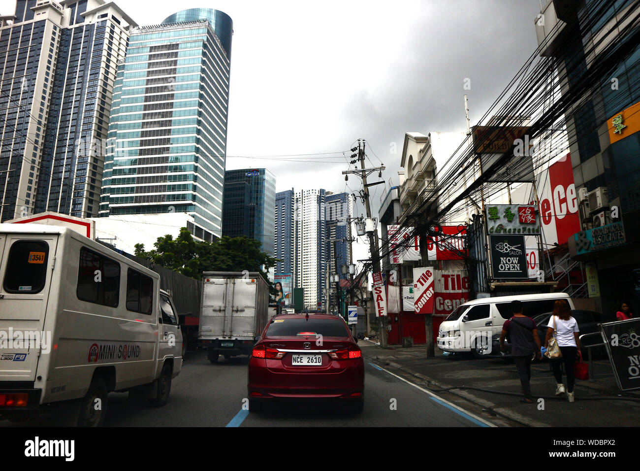 QUEZON CITY, PHILIPPINES – AUGUST 24, 2019: Cars and other vehicles ...