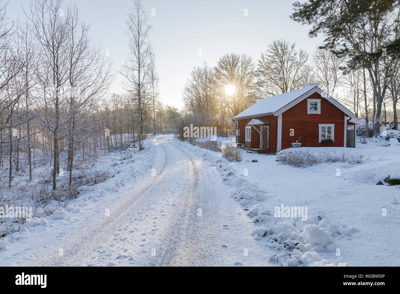 House next to snowy rural road Stock Photo - Alamy