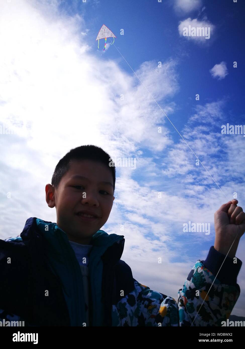 Boy looking at kite hi-res stock photography and images - Alamy