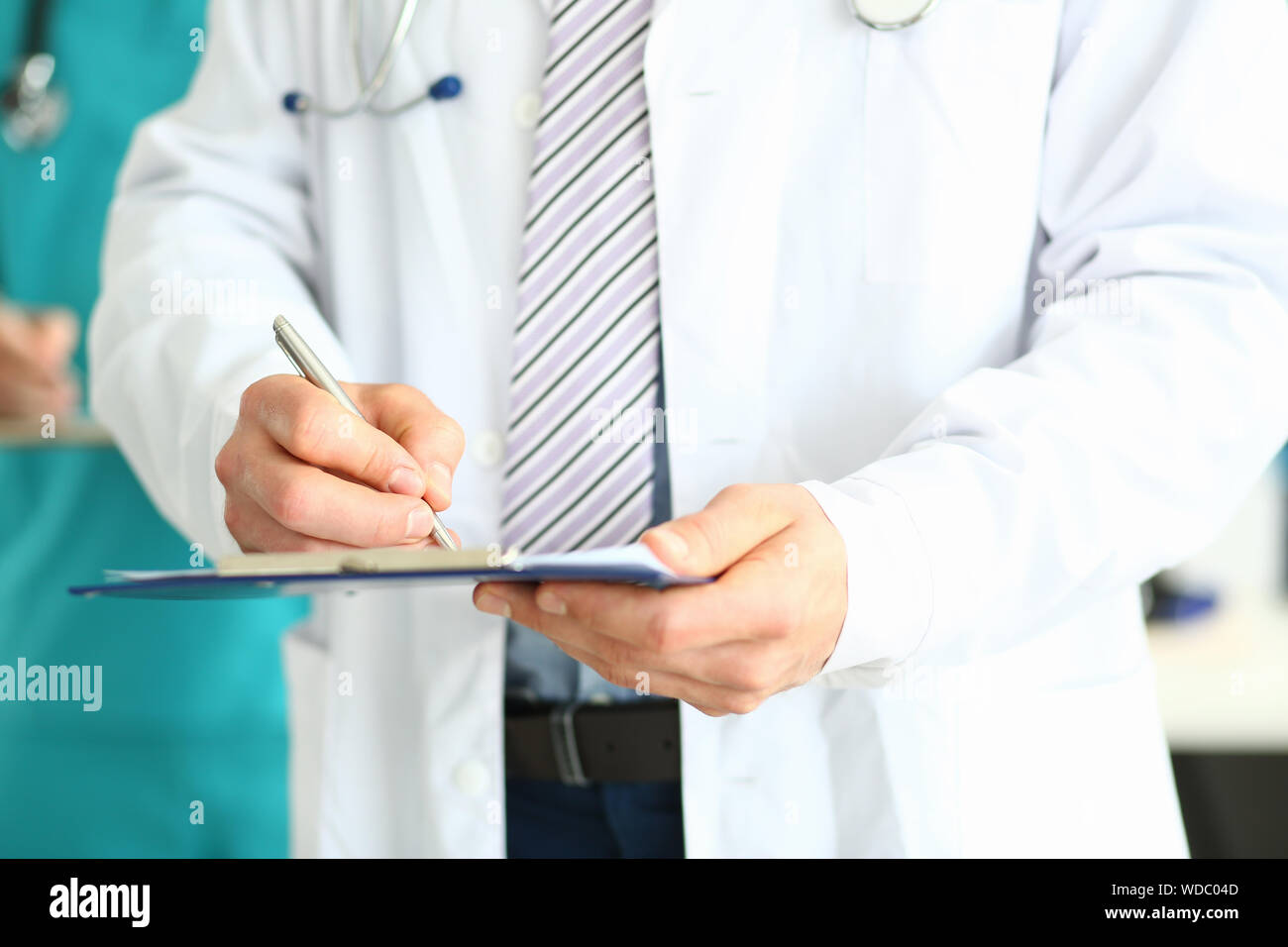 Doctor in white robe hi-res stock photography and images - Alamy