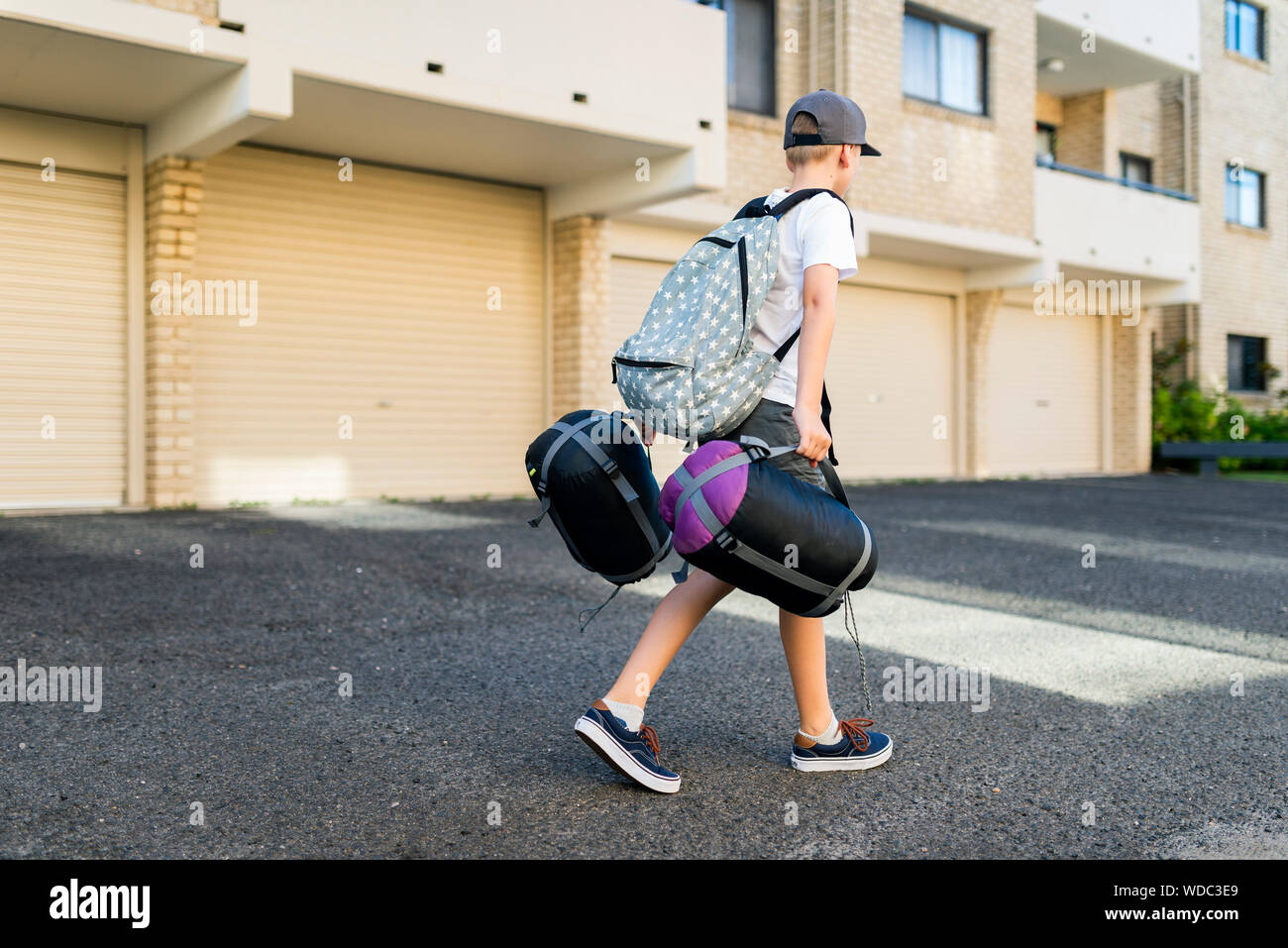 Boy wearing backpack High Resolution Stock Photography and Images - Alamy