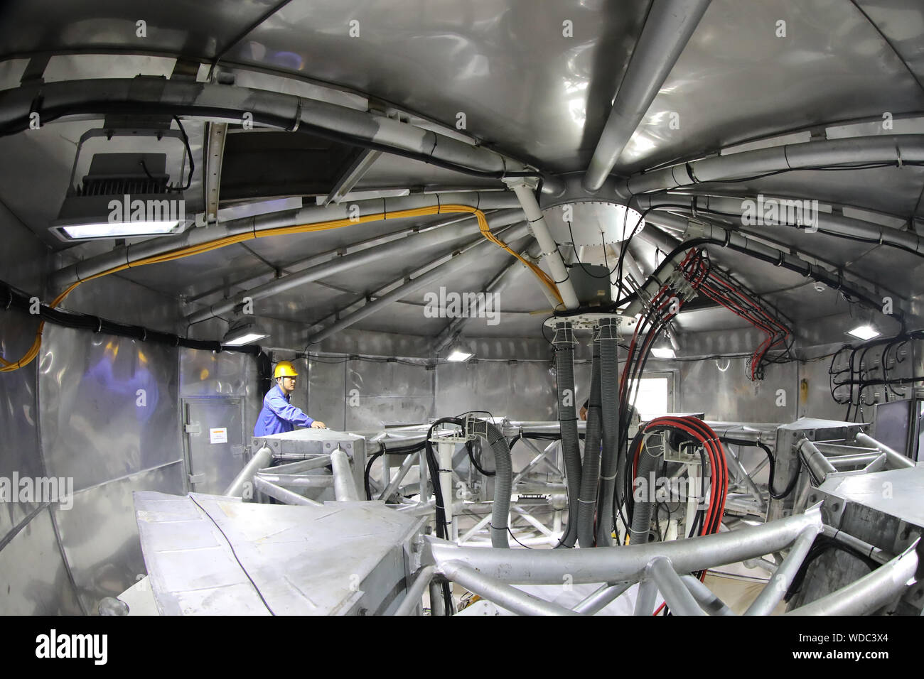 Pingtang. 28th Aug, 2019. A staff member conducts maintenance operation ...