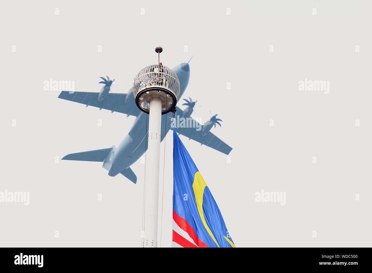 Military Aircraft In Clear Sky Flying Over Malaysian Flag Stock Photo ...
