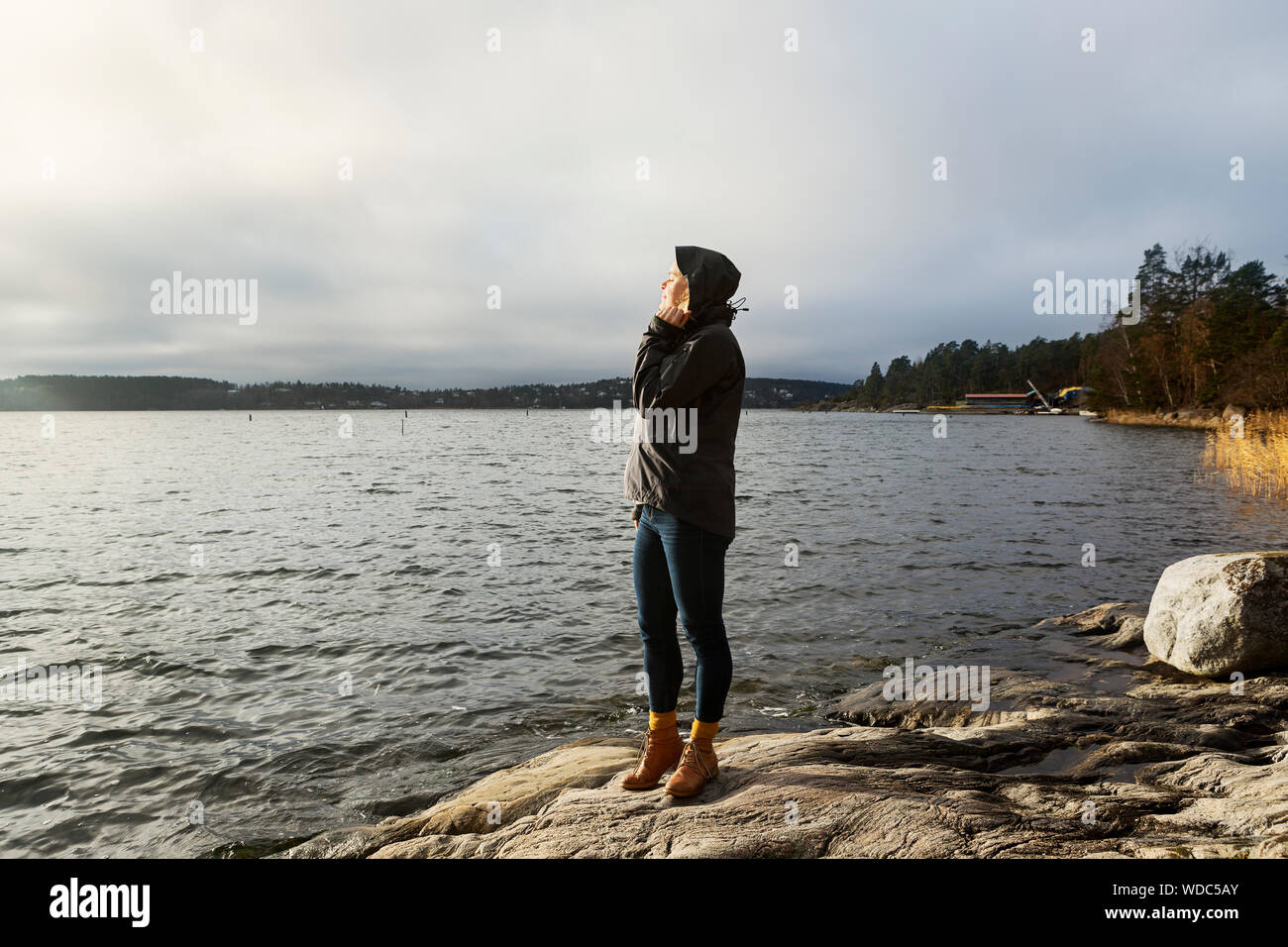 Young woman standing next to hi-res stock photography and images - Alamy