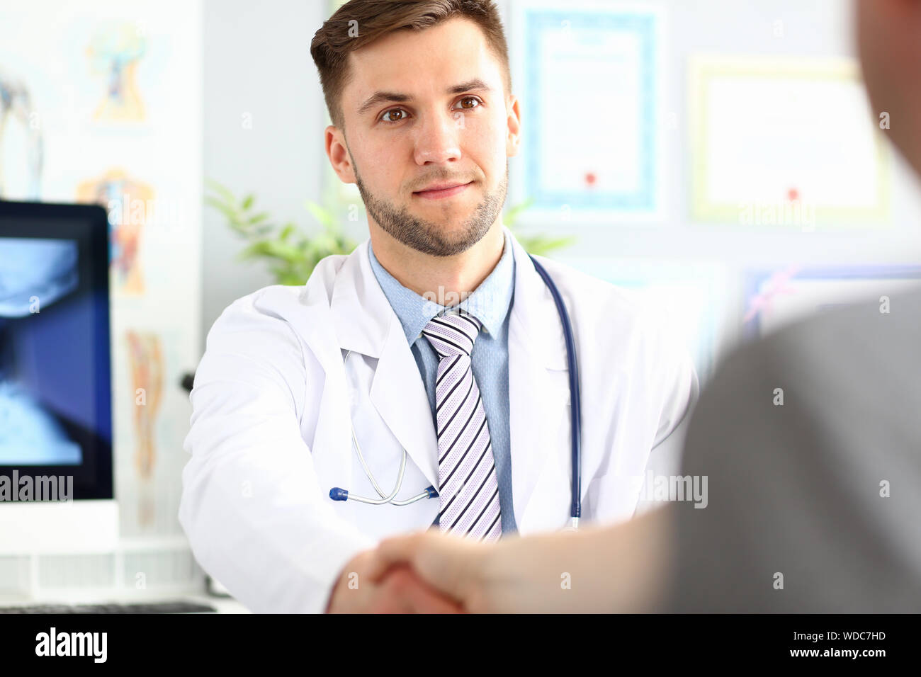 Shaking hand patient hi-res stock photography and images - Alamy