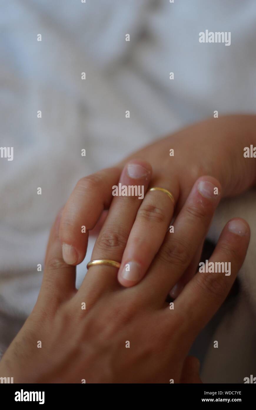 Wearing wedding ring on finger hi-res stock photography and images - Alamy