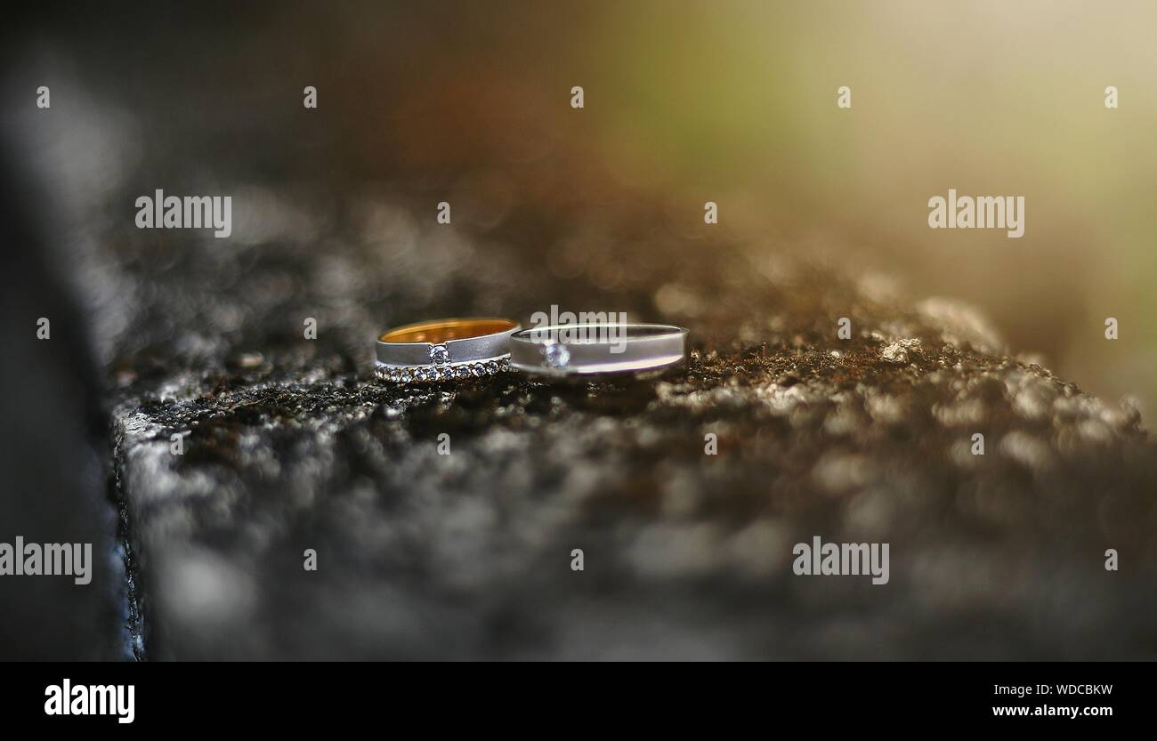 Close-up Of Wedding Rings On Retaining Wall Stock Photo - Alamy