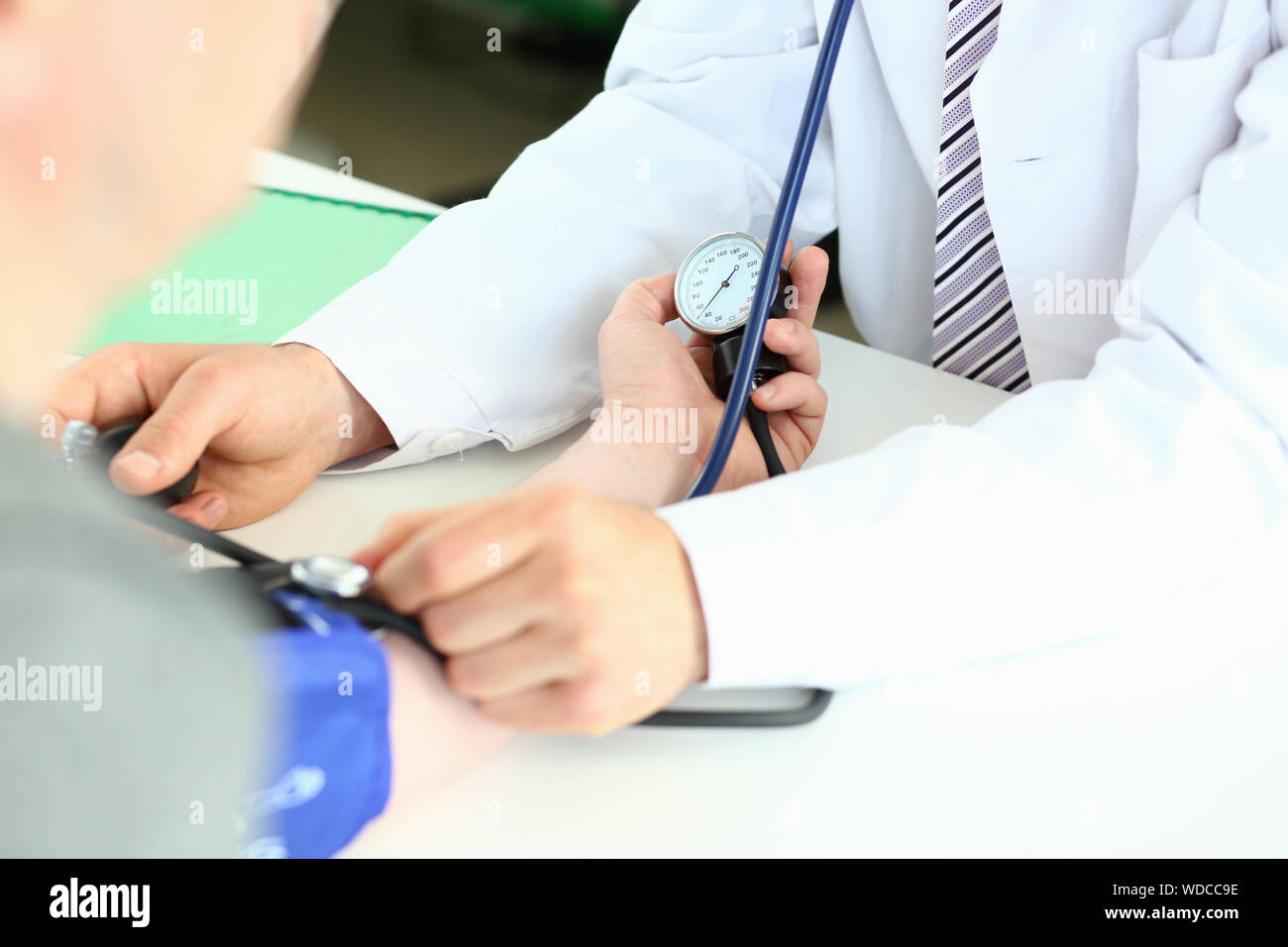 Professional physician with pulsometer Stock Photo - Alamy