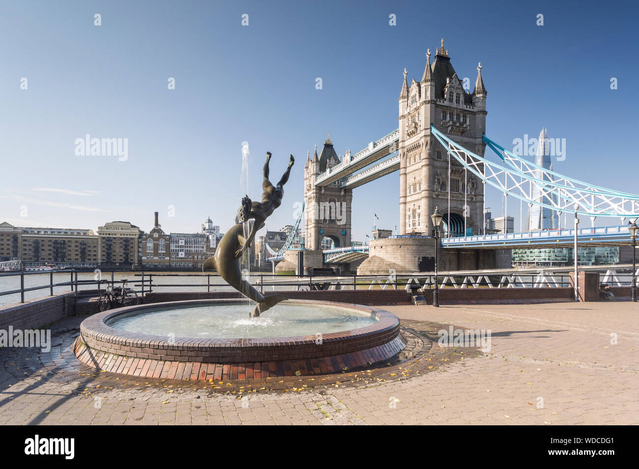 The Dolphin statue and Tower Bridge, London. The Girl with the Dolphin ...