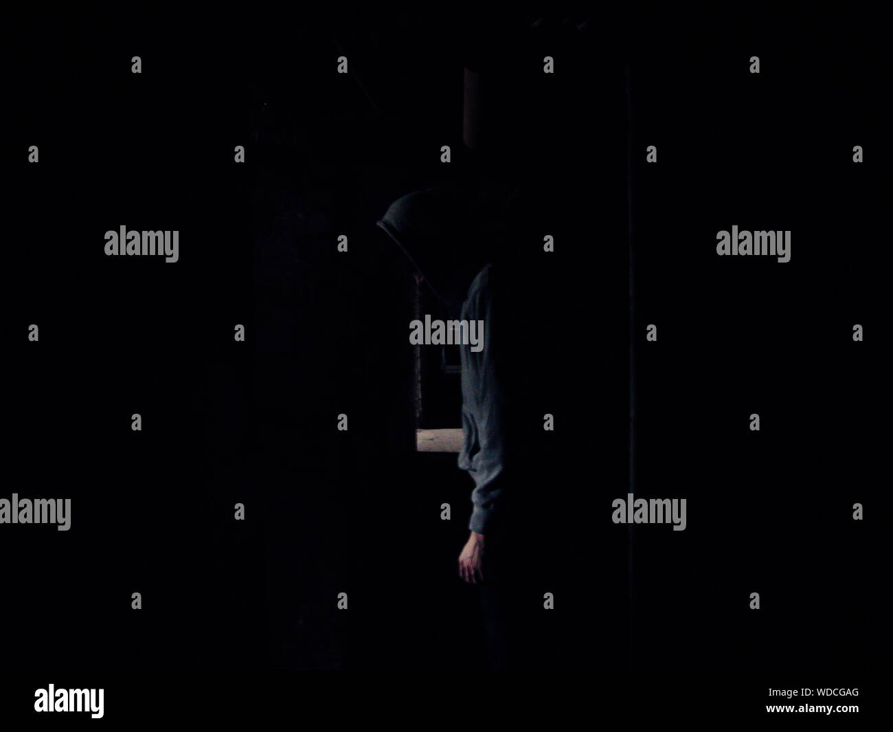 Hood in the dark hi-res stock photography and images - Alamy