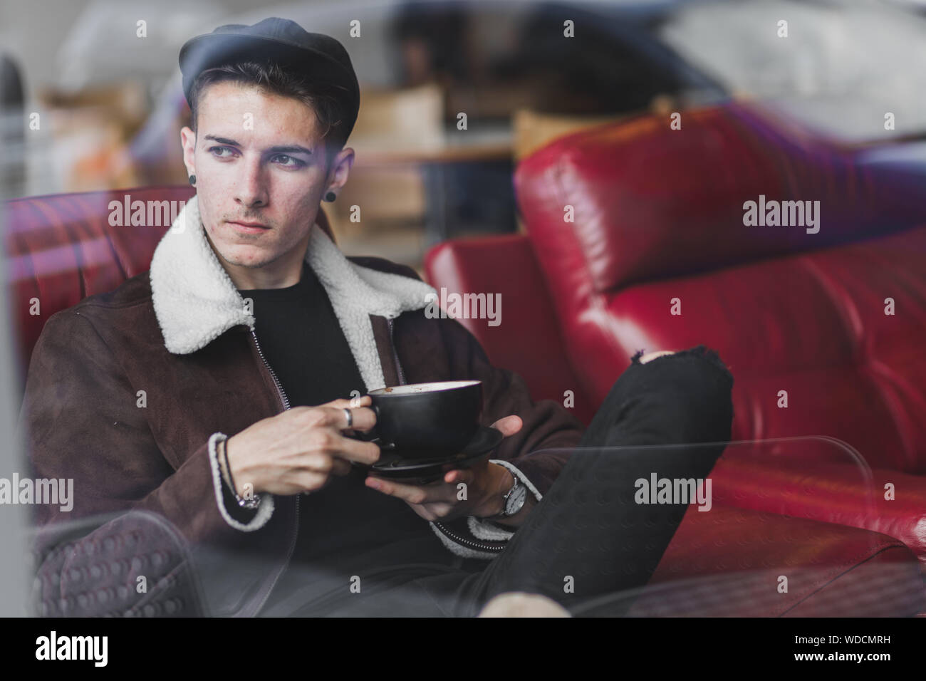Man sitting in cafe hi-res stock photography and images - Alamy