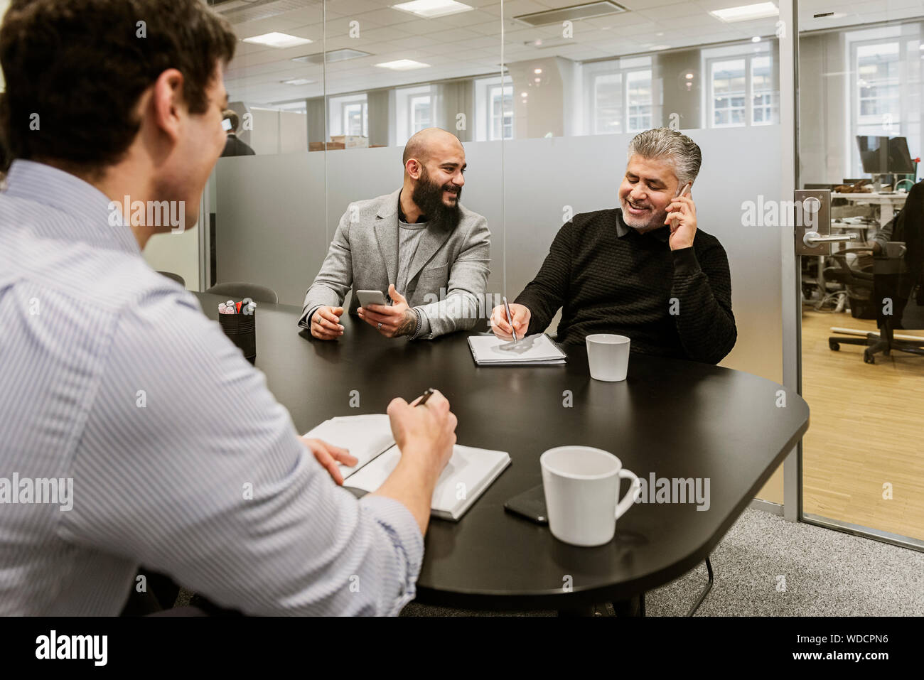 Three men conference hi-res stock photography and images - Alamy