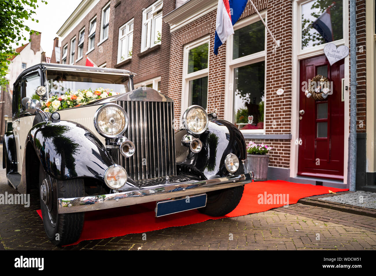 Classic old-timer in original condition driving through the streets of ...