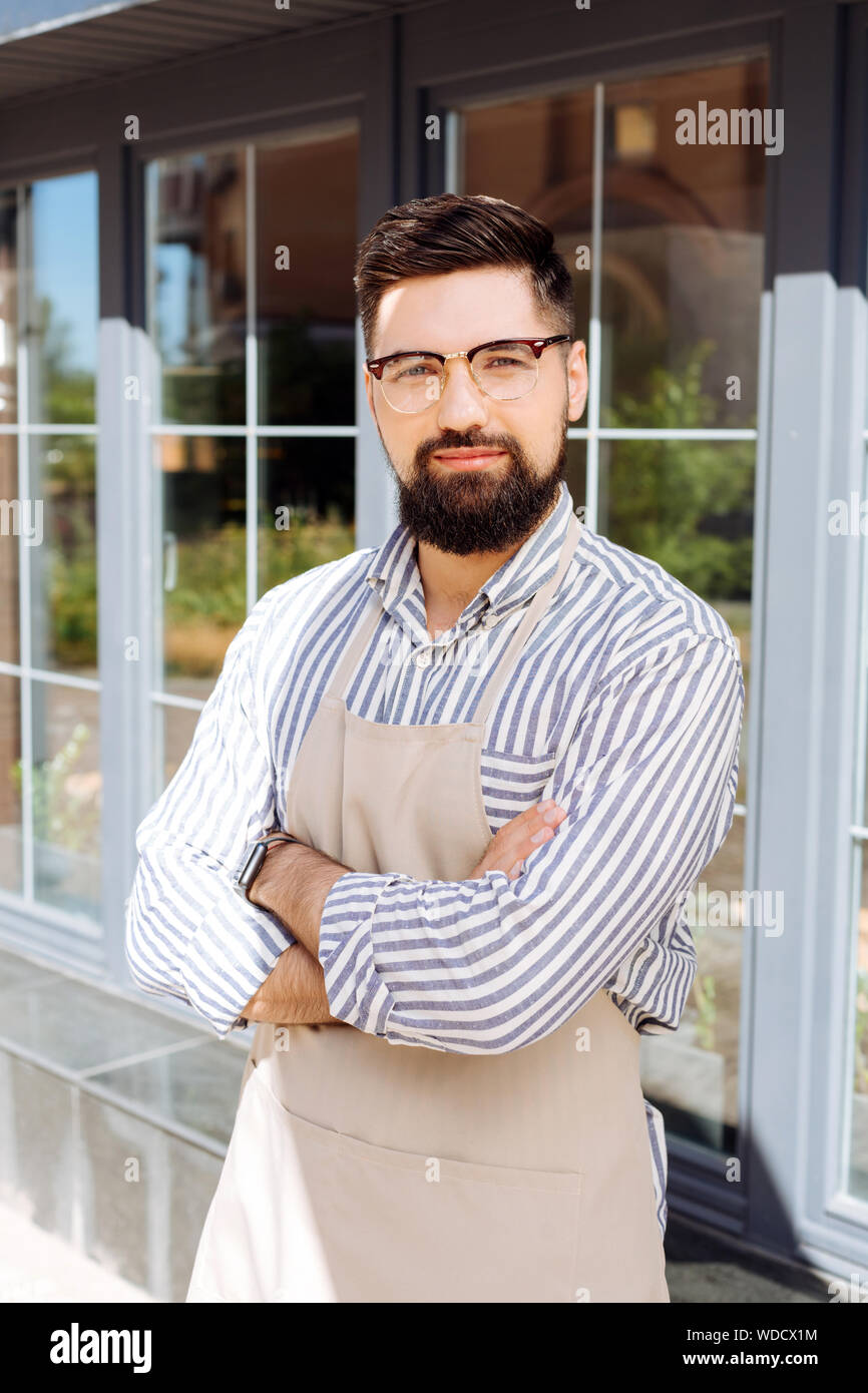 Handsome bearded man standing in front of his restaurant Stock Photo ...