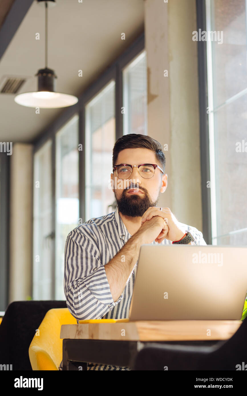 Nice good looking man thinking about his work Stock Photo - Alamy