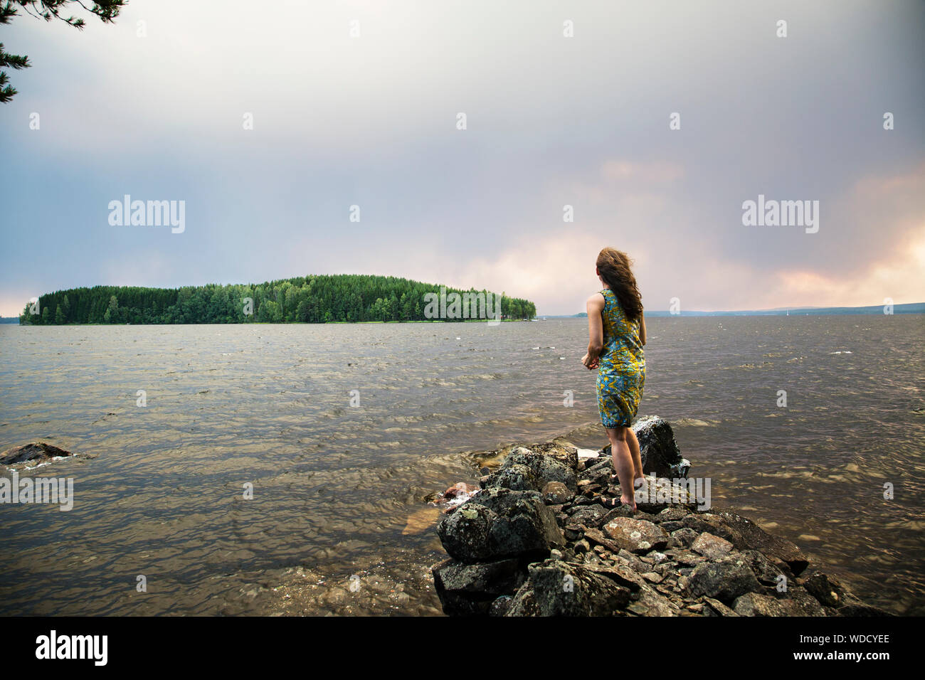Woman standing looking at view hi-res stock photography and images - Alamy