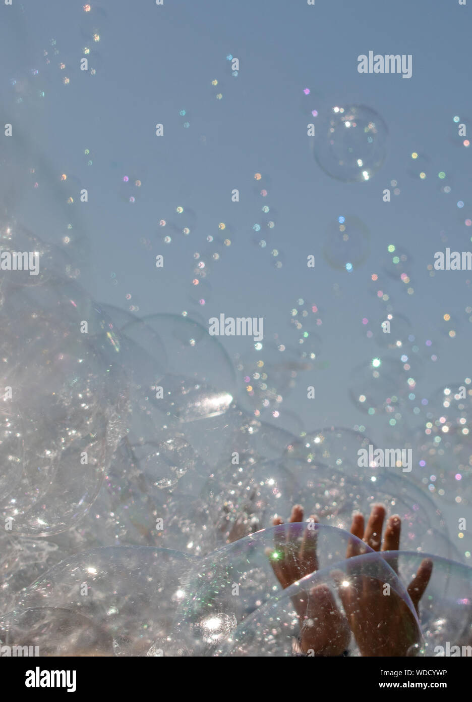Hands in Bubbles Stock Photo - Alamy