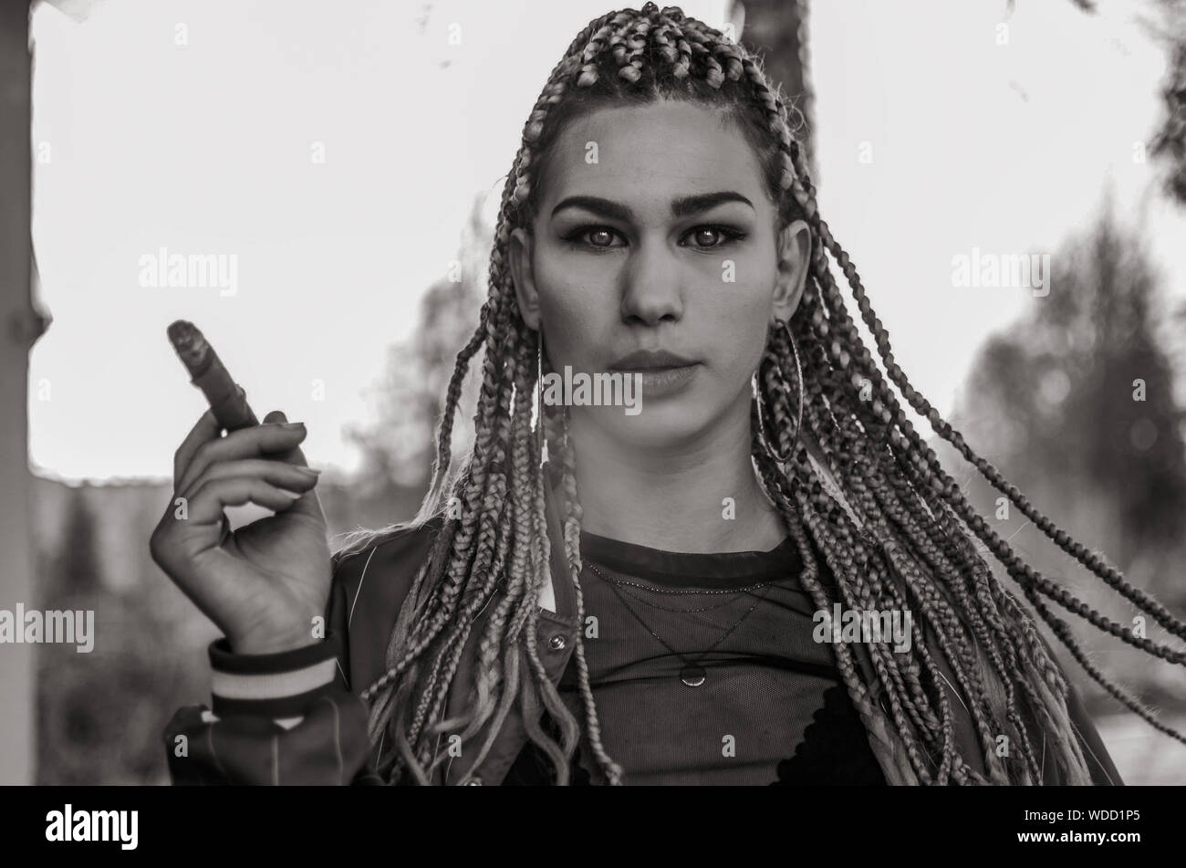 Young woman smoking cigar addiction hi-res stock photography and images ...