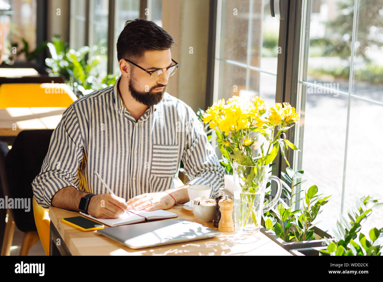 Serious smart man thinking about what to write Stock Photo - Alamy