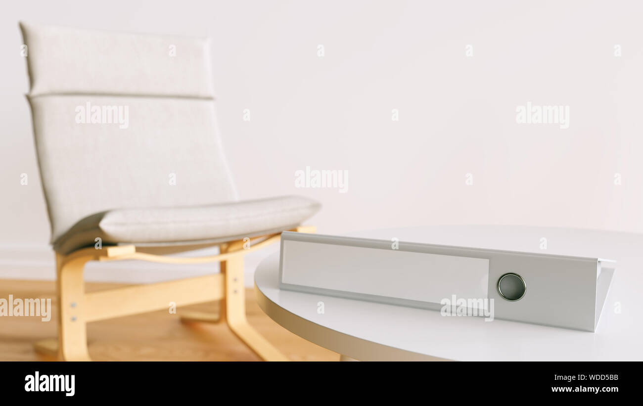 File folder on a modern table with chair in the background in a light ...