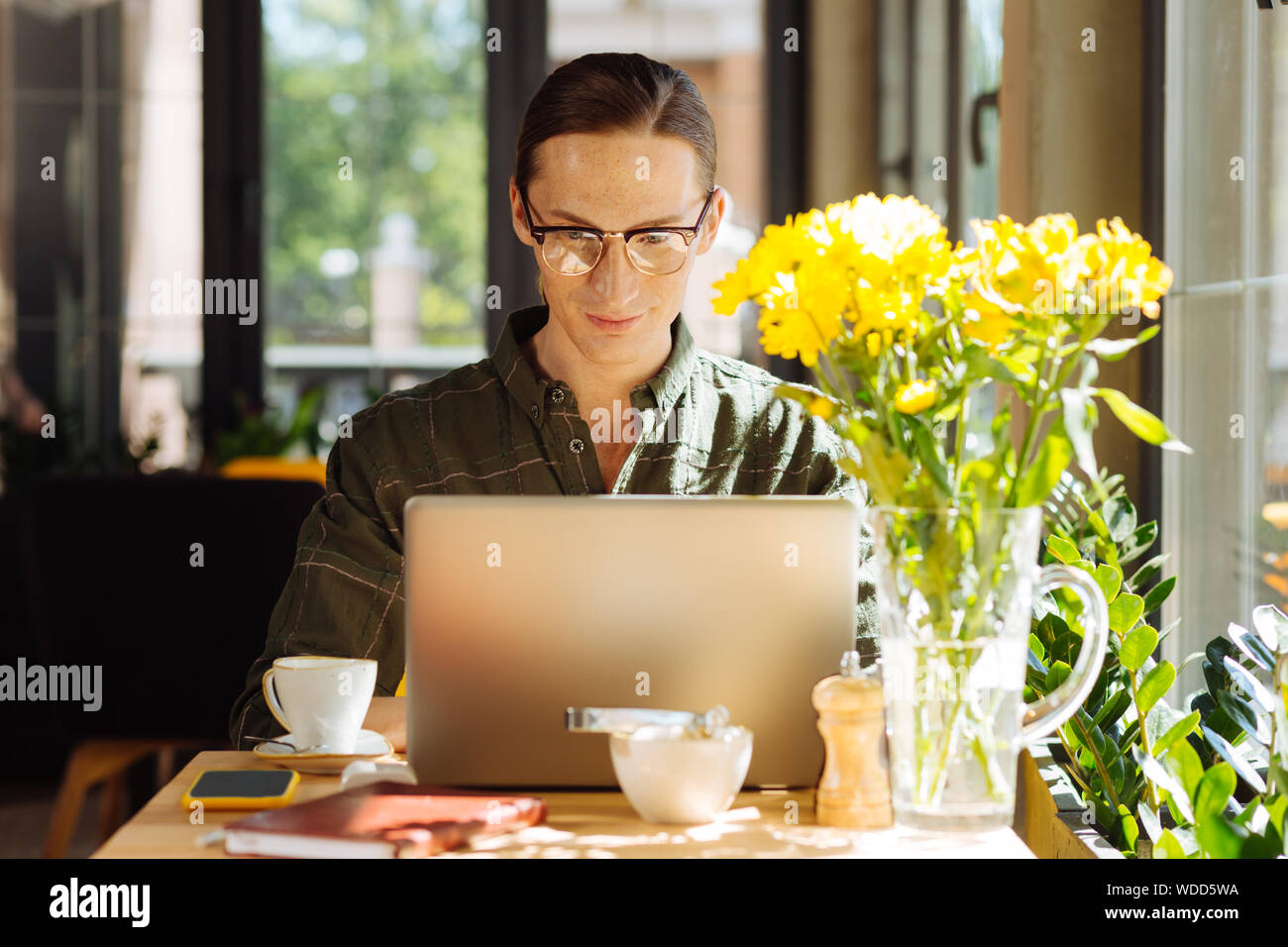 Handsome smart man concentrating on his work Stock Photo - Alamy