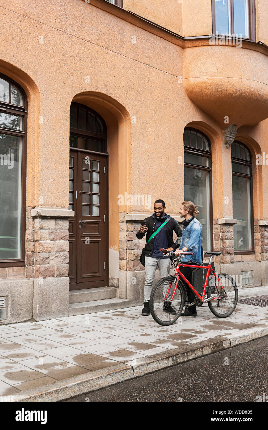 Two young men walking on hi-res stock photography and images - Alamy