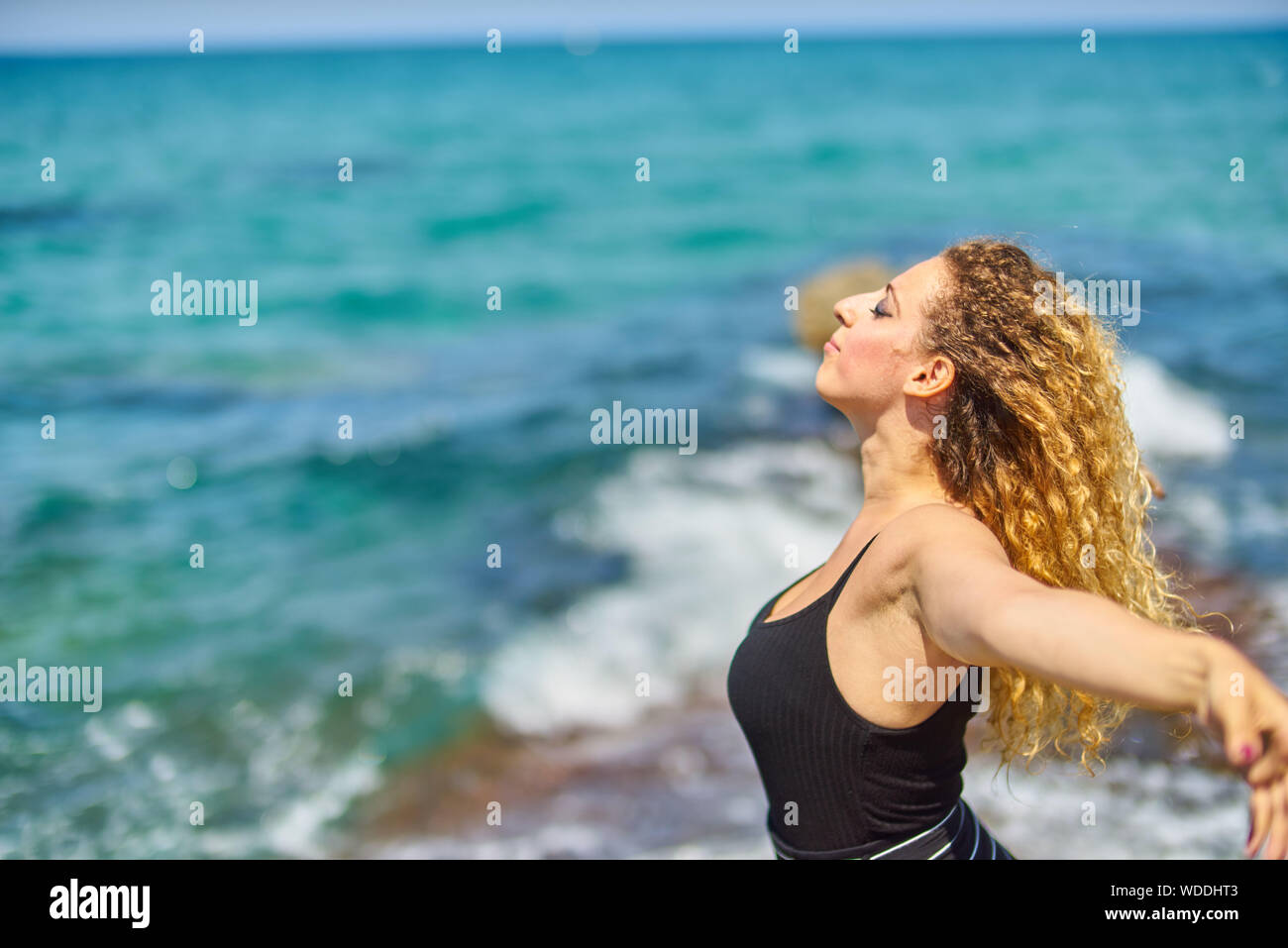 Young woman side view beach hi-res stock photography and images - Alamy
