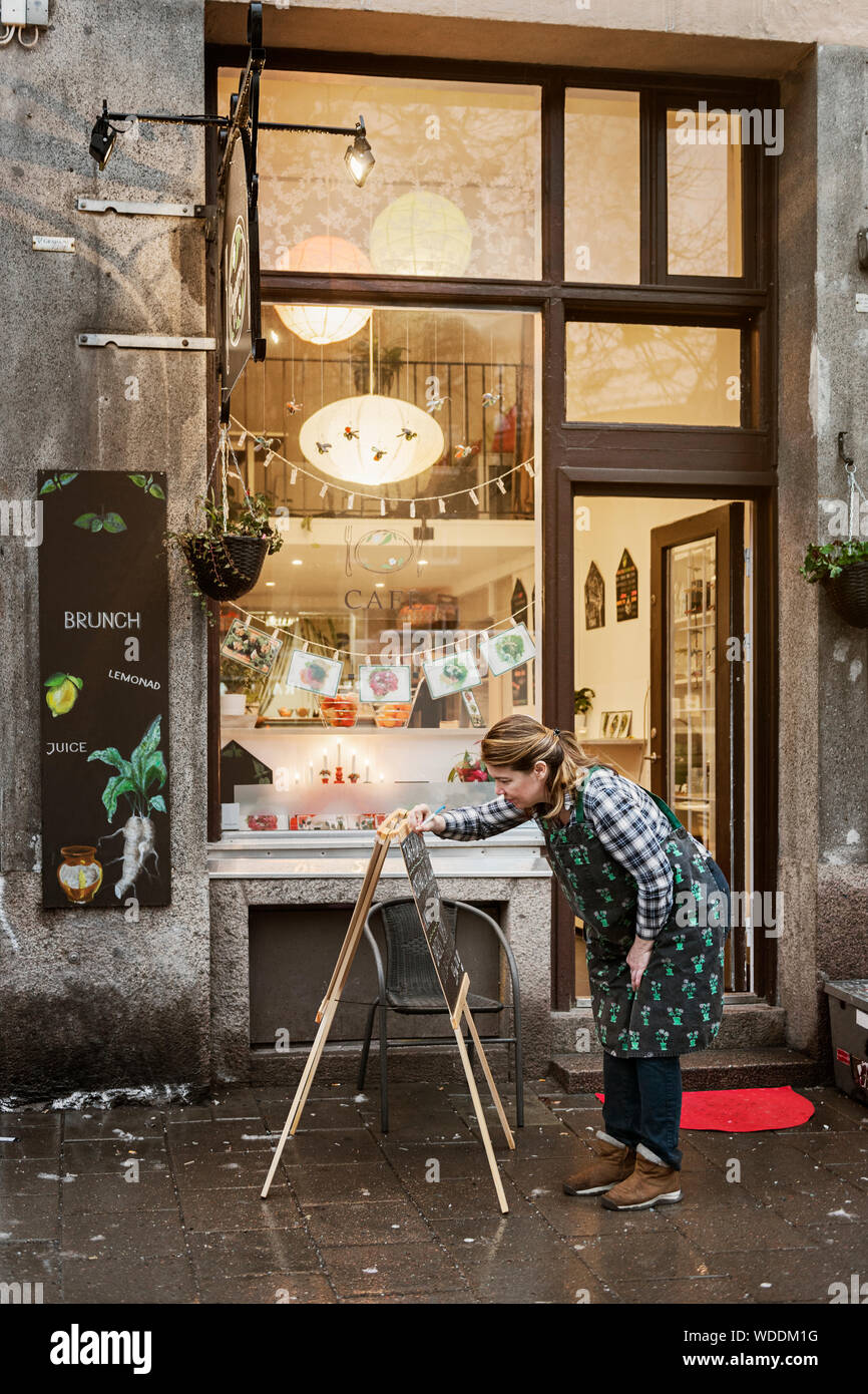 Women writing by window hi-res stock photography and images - Alamy