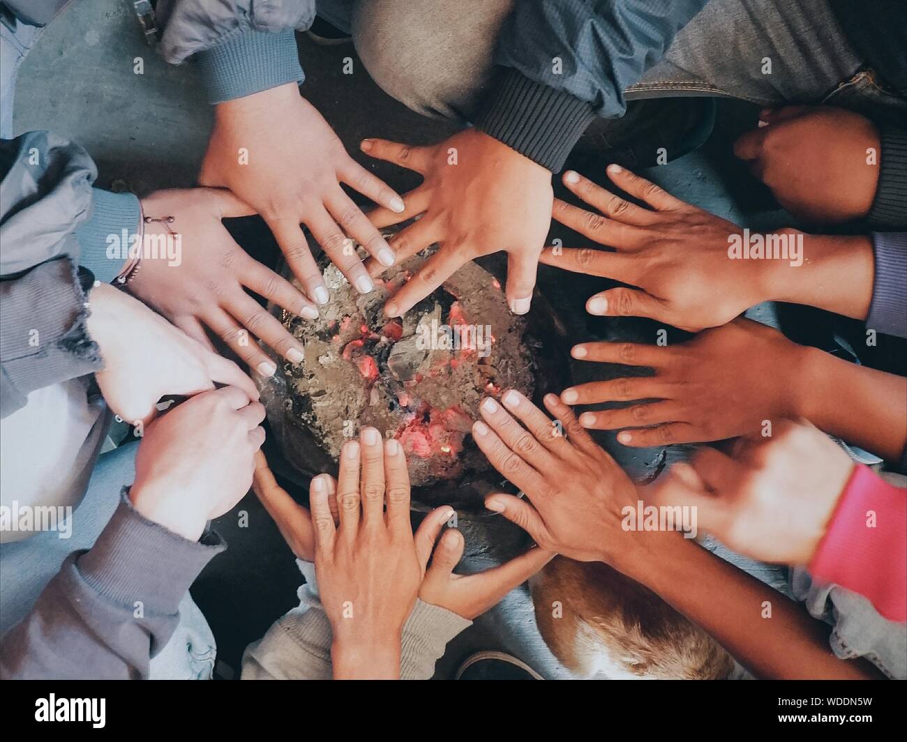 Warming fire hands hi-res stock photography and images - Alamy