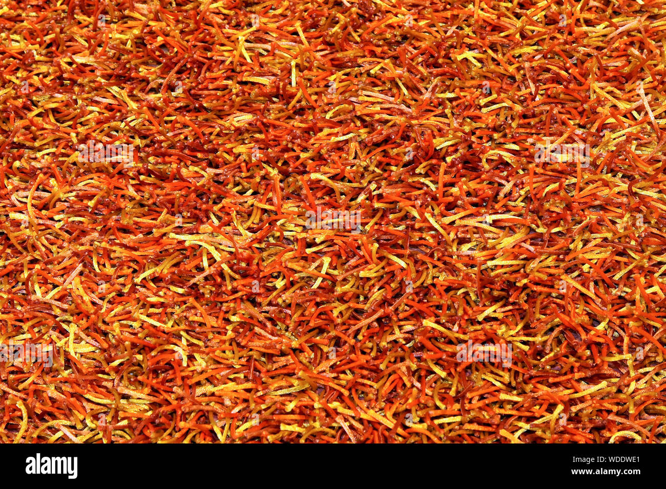 Modern design of carpet with strings orange Stock Photo - Alamy