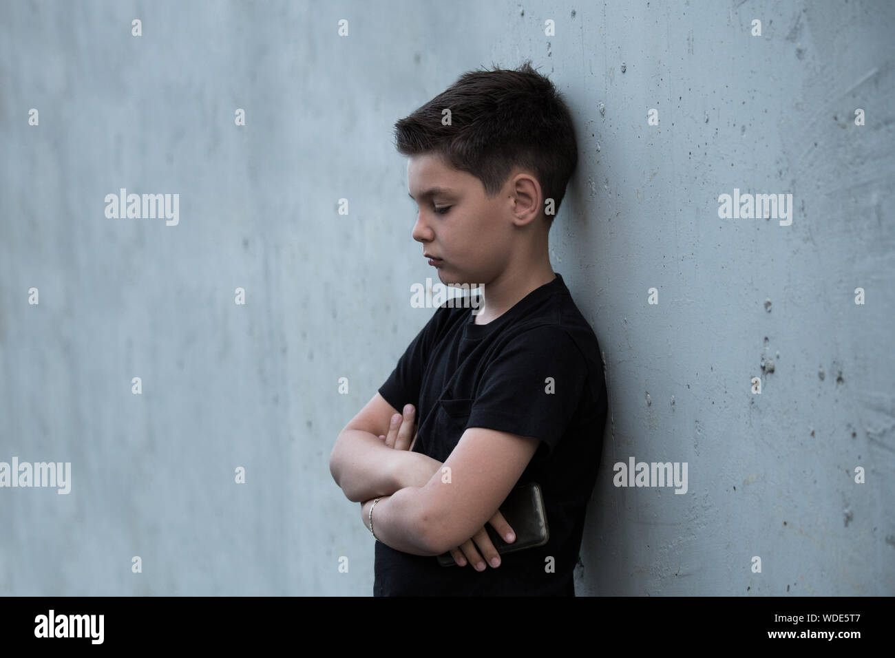 Portrait of a sad teenage boy looking thoughtful about troubles ...