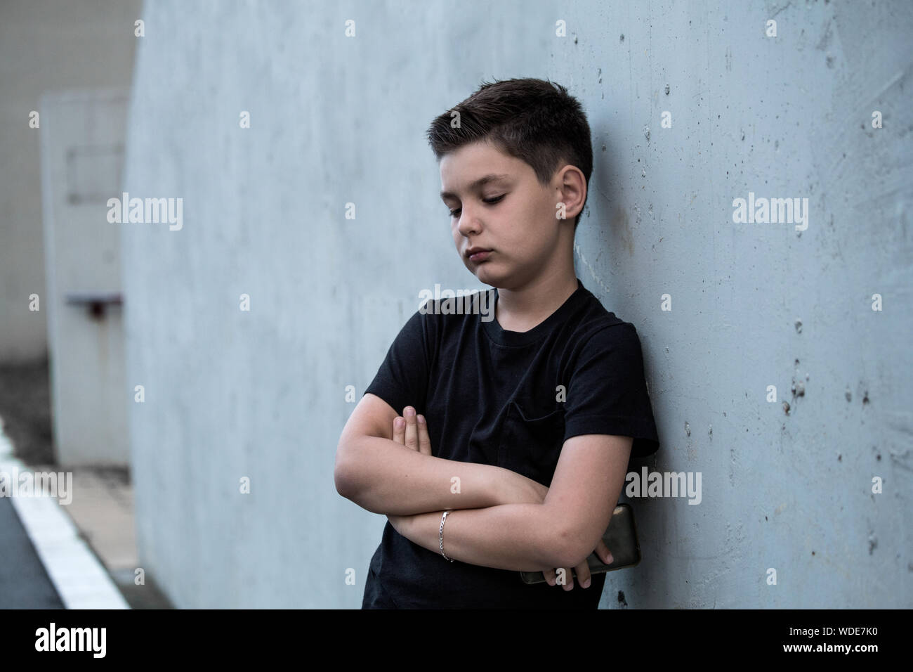 Portrait of a sad teenage boy looking thoughtful about troubles ...