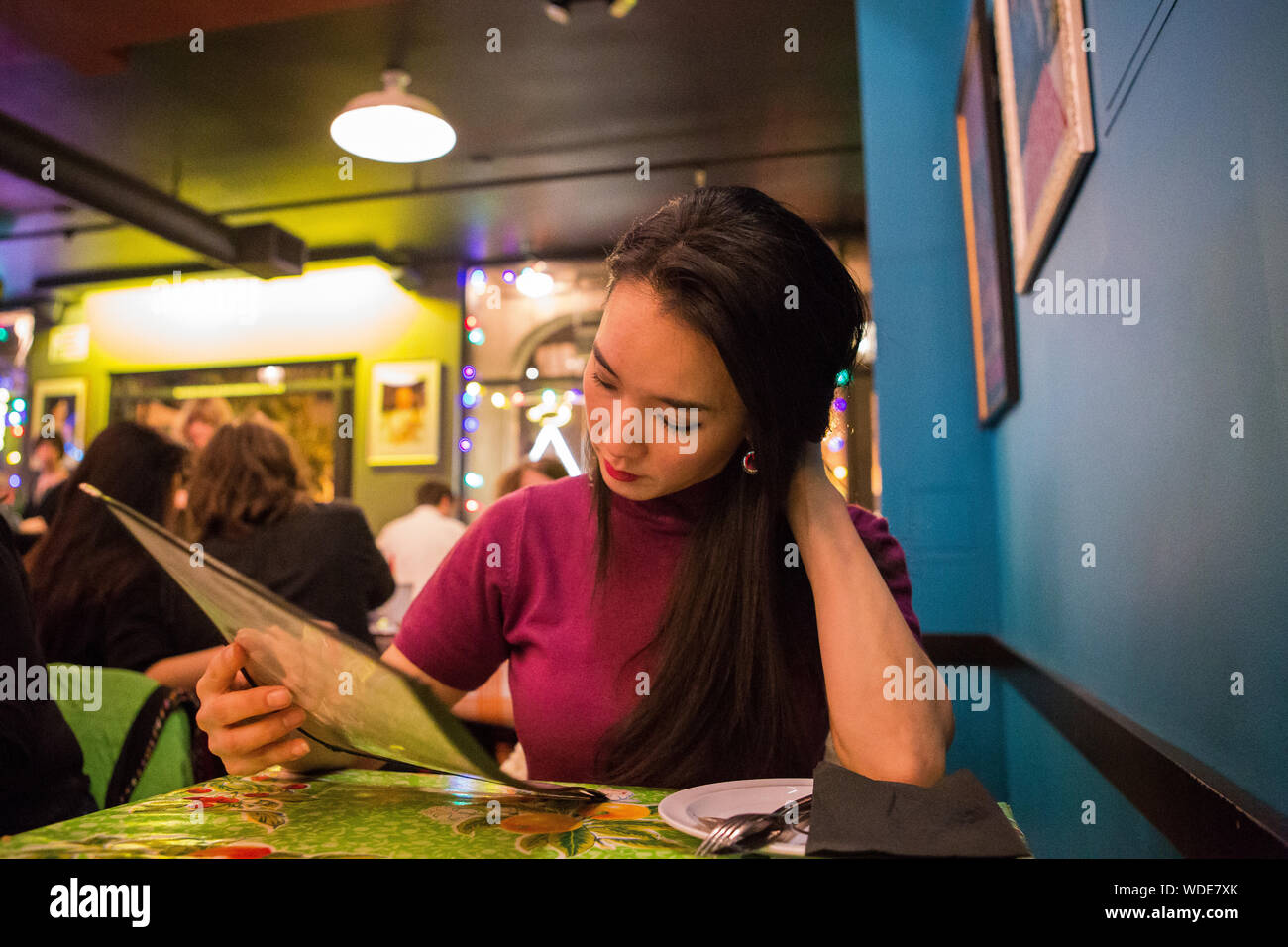 Woman reading menu in restaurant hi-res stock photography and images ...