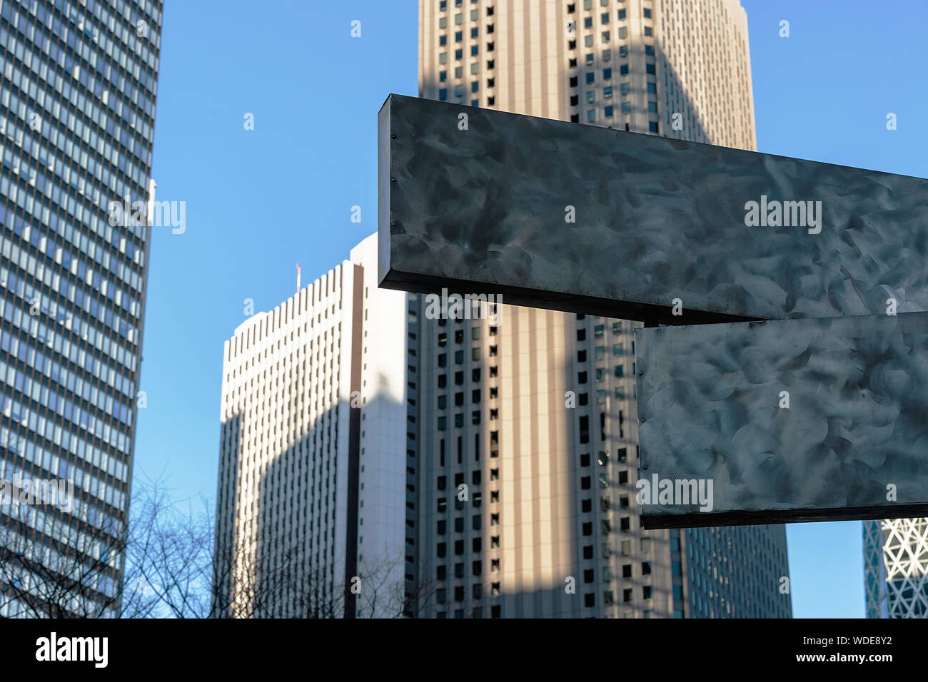 Concrete signs and high rise buildings in downtown Tokyo Stock Photo ...