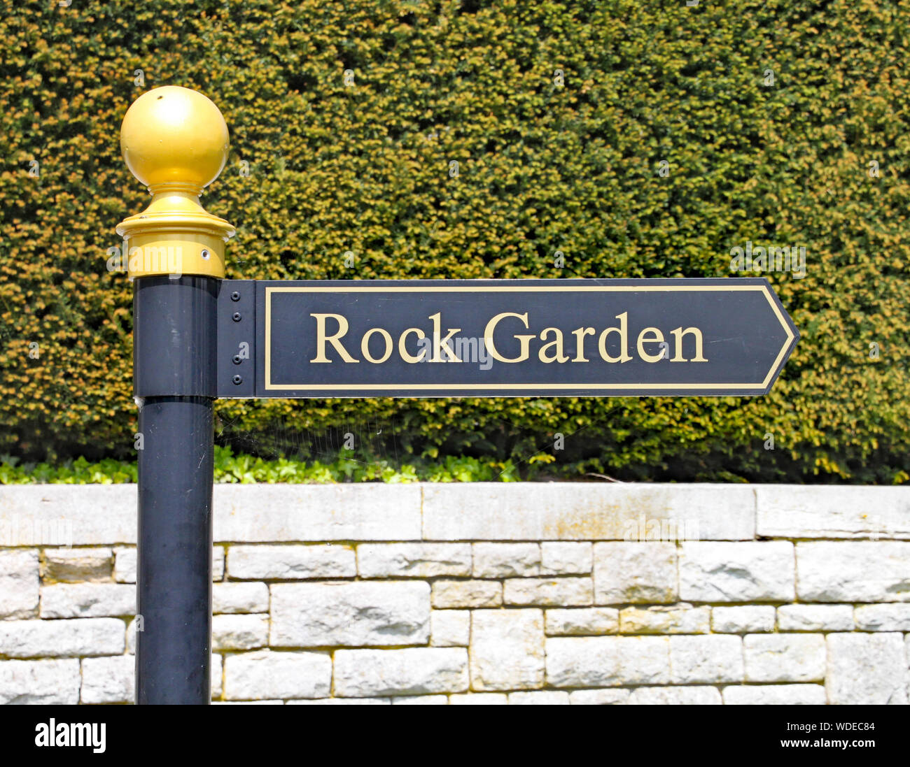 A sign pointing to the Rock Garden Stock Photo - Alamy