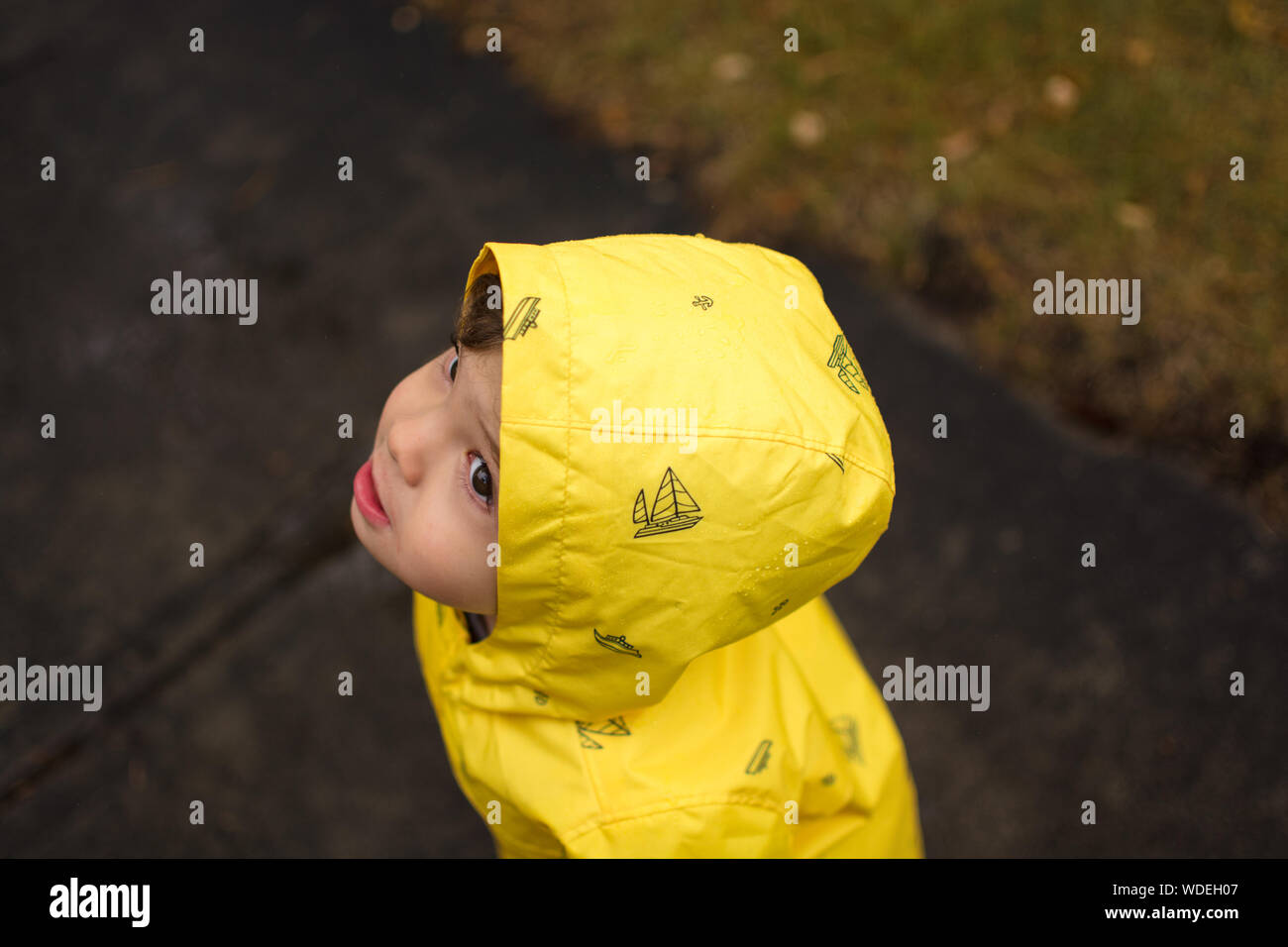 Boy Wearing Raincoat High Resolution Stock Photography and Images - Alamy